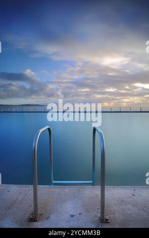 Collaroy Ocean Pool, Sydney, Australia a concrete pool surrounded by a ...