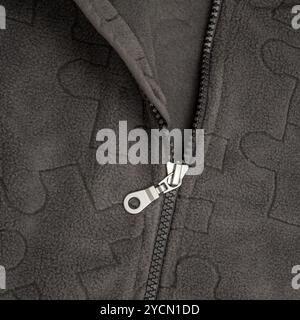 Zip zipper close up macro on red clothes background Stock Photo - Alamy