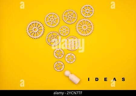 This intriguing series of images utilizes wooden gears and the word ...