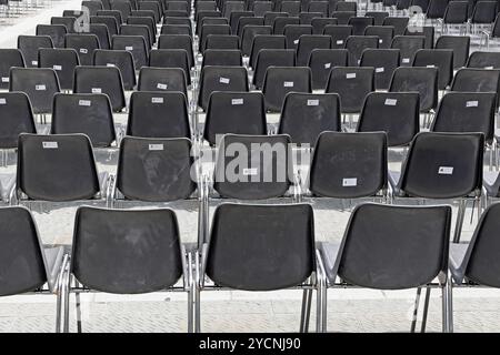 Empty gray portable plastic chairs for audience Stock Photo - Alamy