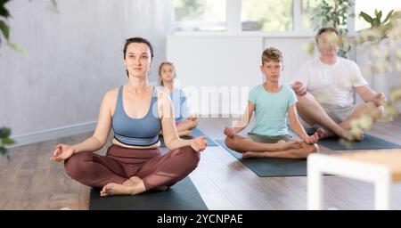 Woman performs lotus pose, folding fingers in mudra of knowledge Stock ...