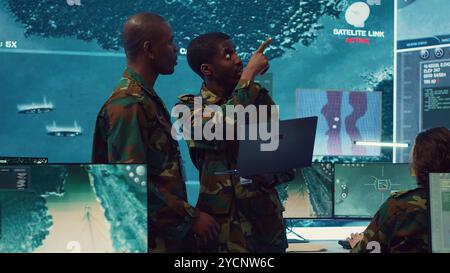 Signal support systems specialists work with battlefield data and ...