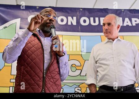 U.S. Sen. Rev. Raphael Warnock casts his primary ballot Friday, May 6 ...