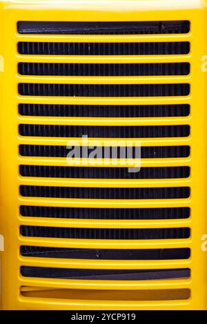 Yellow radiator cooling grill at construction machine Stock Photo - Alamy
