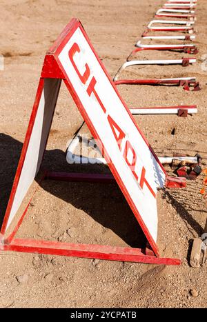 The starting line in motocross competition, text on russian: "Start ...