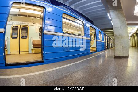 Blue subway train standing at the underground station. Wide angle Stock ...