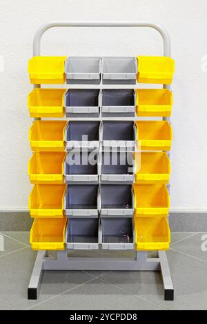 Yellow plastic box shelf for warehouse ; close up Stock Photo - Alamy