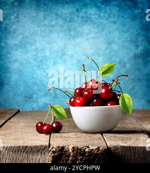 Pile of ripe cherries on blue background. Cherry background. Fresh ...