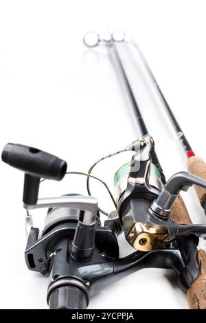 different fishing tackles - rod, reel, line and lures on white ...