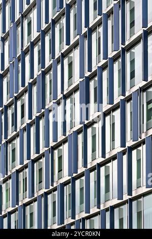 Modern office building with blue fin pattern Stock Photo - Alamy
