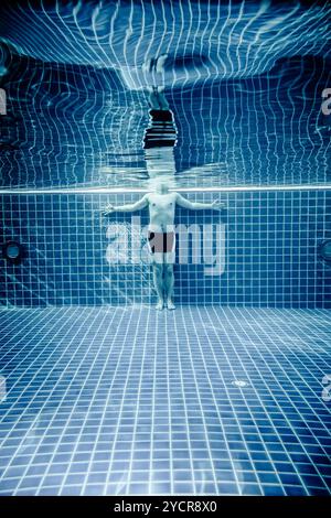 Persons standing under water in a swimming pool Stock Photo - Alamy