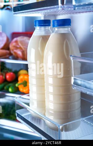 Bottles of milk in the fridge Stock Photo - Alamy