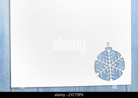 White origami ball on a wooden table. Colorful light. Geometric, paper ...