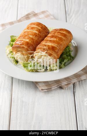 French puff pastry tubes stuffed with bechamel cheese sauce close-up in ...