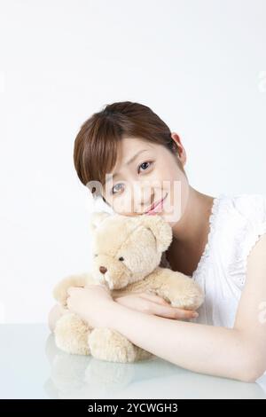 Woman holding stuffed animal Stock Photo - Alamy