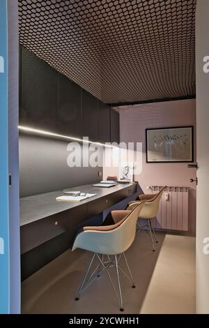 A cozy, contemporary home office or private office featuring a computer ...
