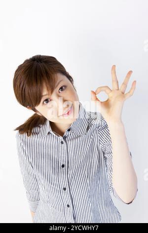 Woman giving the ‘okke’ sign Stock Photo - Alamy