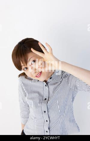 Woman giving the ‘okke’ sign Stock Photo - Alamy