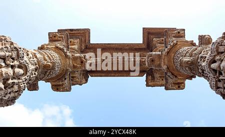 Carved Kirti Toran, a pair of 12th-century columns, about 40 feet tall ...