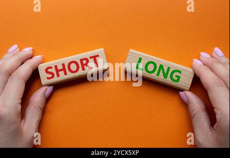 Short vs Long symbol. Concept word Short vs Long on wooden blocks ...