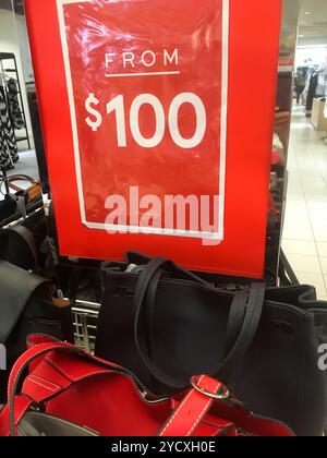 Sale Sign and handbags on display in shop front window Stock Photo - Alamy