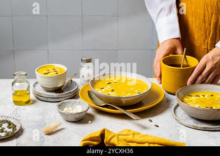 Pumpkin soup in the craft bowl at stone table Stock Photo - Alamy