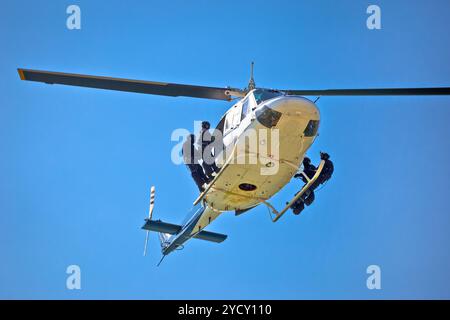 Special forces team ready for helicopter rope jumping Stock Photo - Alamy
