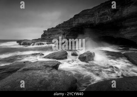 Bulgo Beach sea cave Stock Photo - Alamy