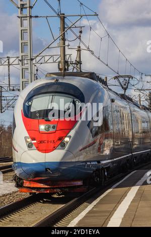 Modern hybrid electric locomotive Sapsan pulling a high-speed train ...