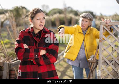 Conflict between female neighbors in country farm Stock Photo - Alamy