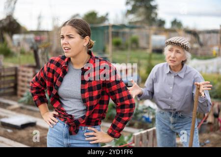 Conflict between female neighbors in country farm Stock Photo - Alamy