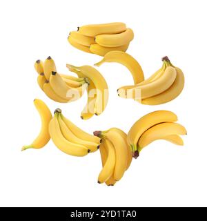 Many yellow bananas in air on white background Stock Photo - Alamy