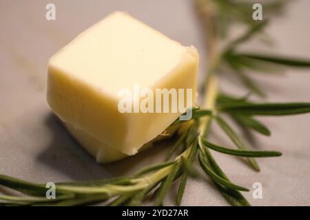 A close-up shot of cubed butter on a small plate, arranged neatly ...