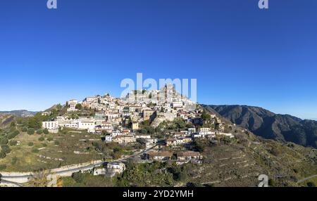 A drone perspective of the picturesque mountain village of Bova in ...