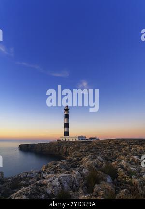 A vertical view of the landmark Cap d'Artrutx lighthouse on Menorca ...