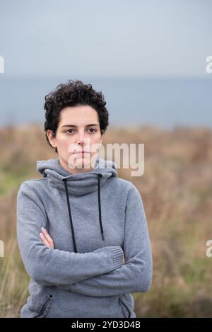 Young middle east woman with arms crossed gesture depressed and worry ...