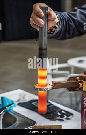 Induction hardening type of surface hardening . Metal part is induction ...