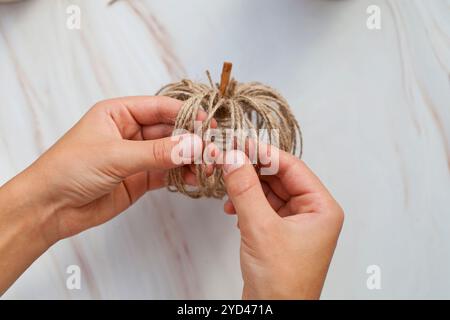 Step by step. How to make a decorative pumpkin form hemp string. Step 1 ...