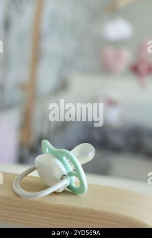 pacifier with a baby room nursery background light pastel colors Stock ...