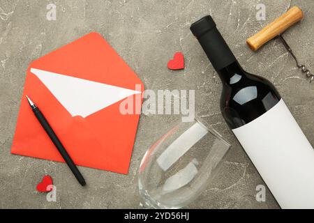 Composition with bottle of wine, envelope and gift for Valentine's Day ...
