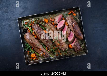 Traditional fried venison back filet with chard Stock Photo - Alamy