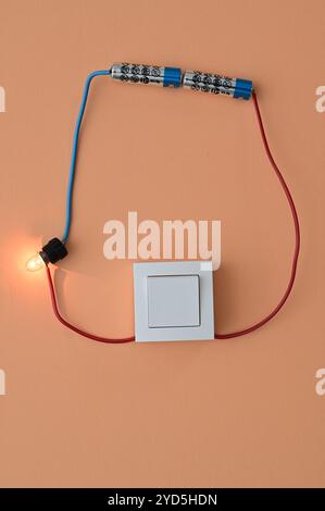 Educational low-voltage electrical circuit including battery, switch ...