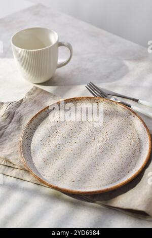 Top view of empty light plate on wooden background. Empty space for ...