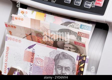 Slovenian tolar in a counting machine Stock Photo - Alamy