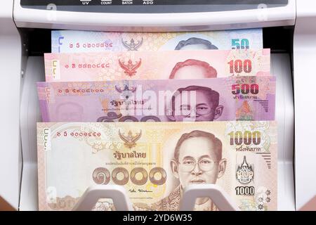 Thai baht in a counting machine Stock Photo - Alamy