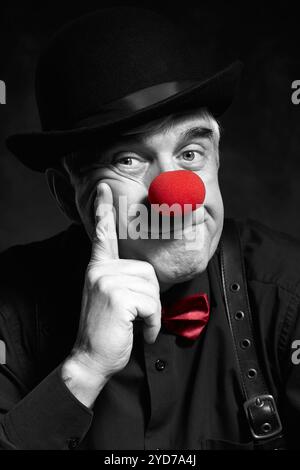 Sad clown against dark background Stock Photo - Alamy