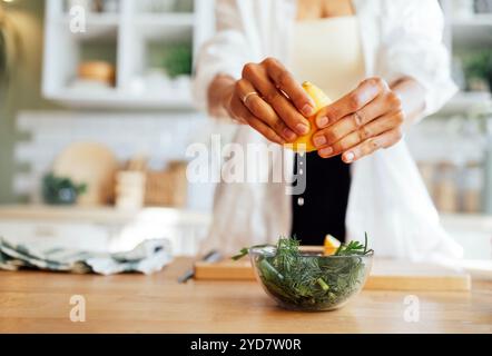 Woman with neat manicure squeezing lemon juice on fresh oyster Stock ...