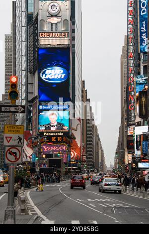 Times Square at night with bright billboards, illuminated city lights ...