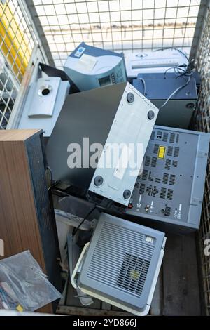 Electronic waste in a pallet cage at the recycling center. Electronic ...