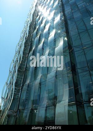 Modern glass building architecture with wavy pattern in Downtown ...